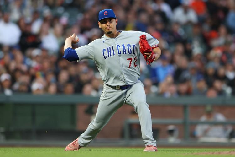 Michael Busch hits 3-run homer to back Javier Assad's strong start ...