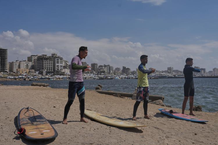Surfers in war-torn Gaza find rare moments of joy taking to the waves ...