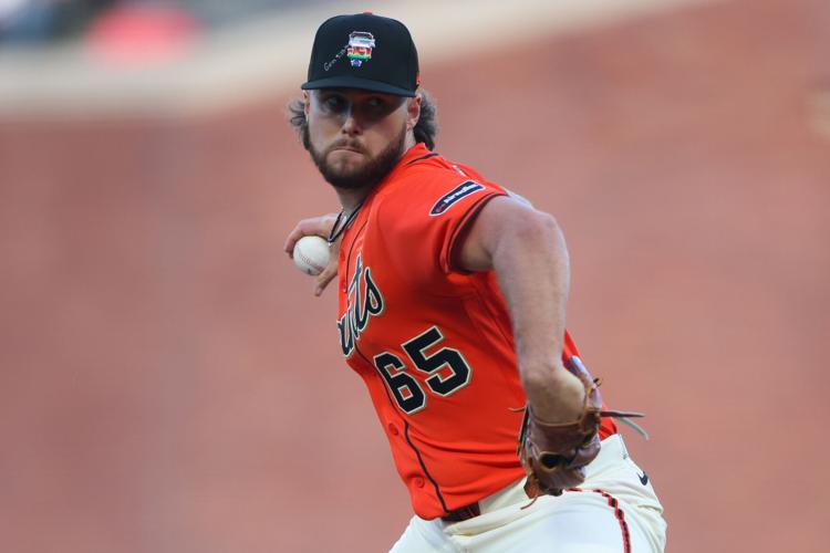 Michael Busch hits 3-run homer to back Javier Assad's strong start ...