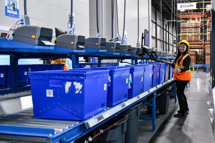 With help from robots, Axcelis opens new logistics center | Business ...
