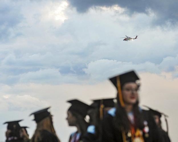Resilience — and raindrops — are themes at Ipswich graduation | Local ...