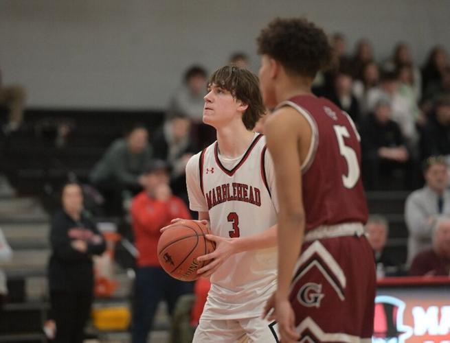 Marblehead boys hoop hangs on to top Gloucester, capture Larry McIntire ...