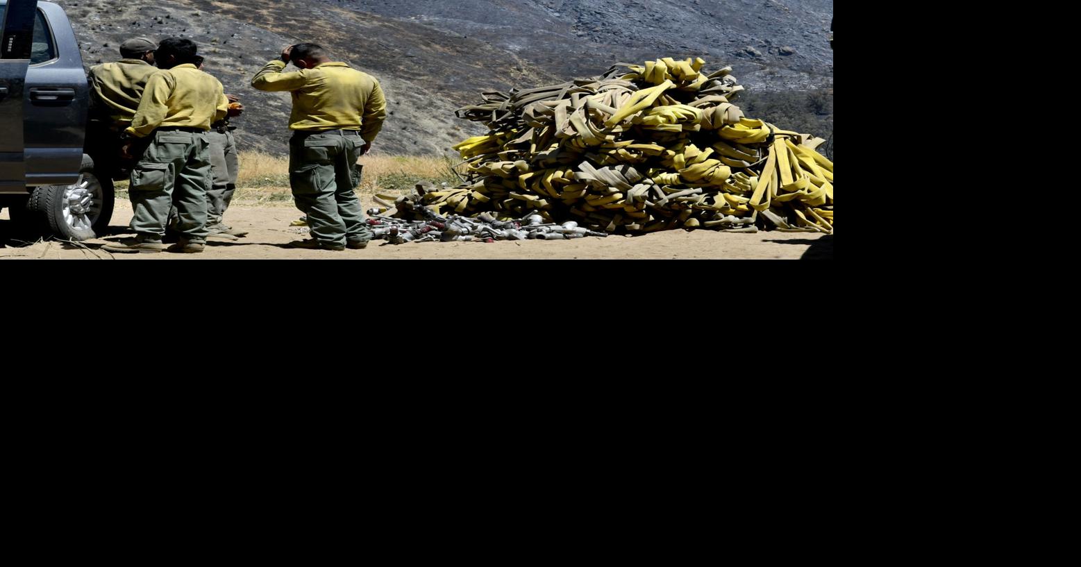 Photos: Fire crews from multiple agencies battle Front fire near Santa ...