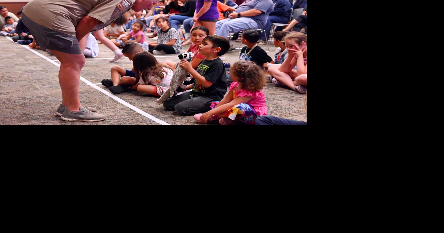 Families meet animals during Wildlife on Wheels Saturday at the Santa ...