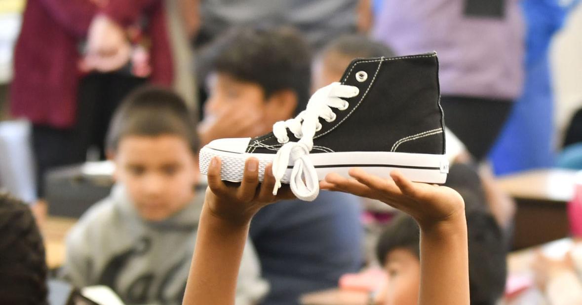 Photos: 100 students at Robert Bruce Elementary receive new shoes ...