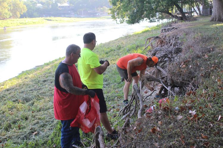 Lake Dunlap residents spend morning removing debris from river’s edge ...