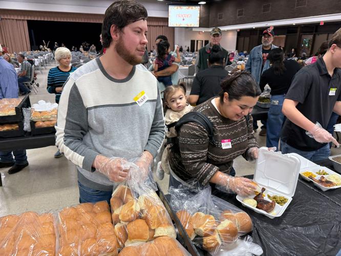 Giving thanks: Volunteers fill Table’s plates at community dinner ...