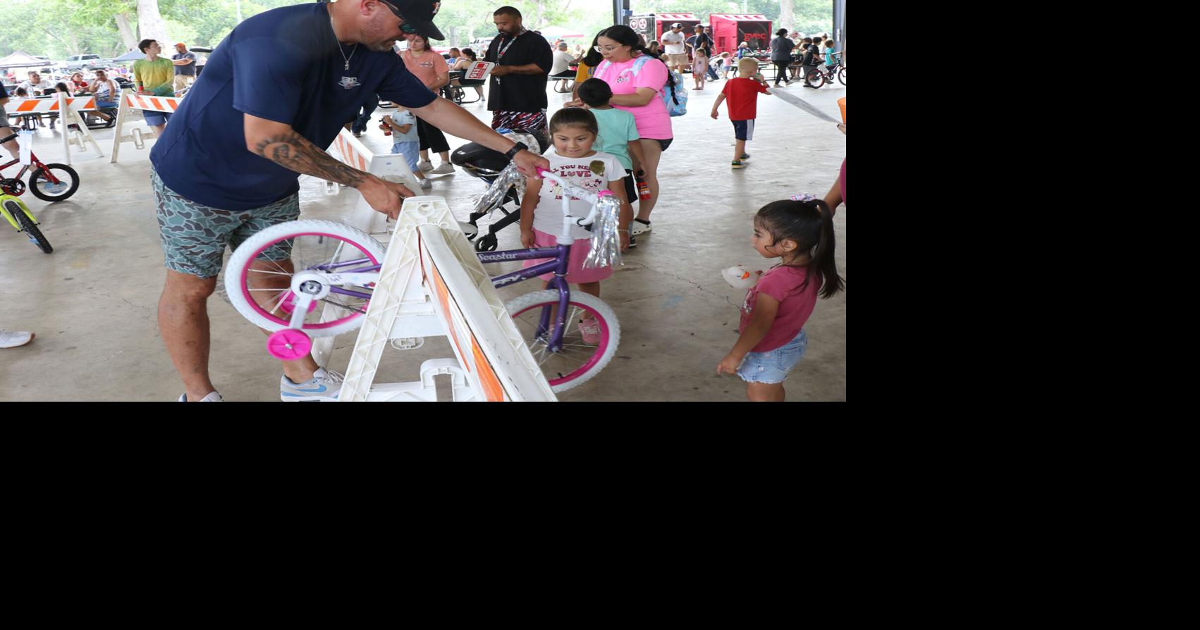 Tykes treated to bikes and fun at first-responder event | News ...