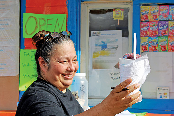 BEATING THE HEAT: Snow Cone stand thanks customers with cool treats ...