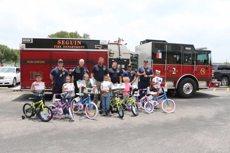 Police, firefighters award bikes for poster contest | News ...