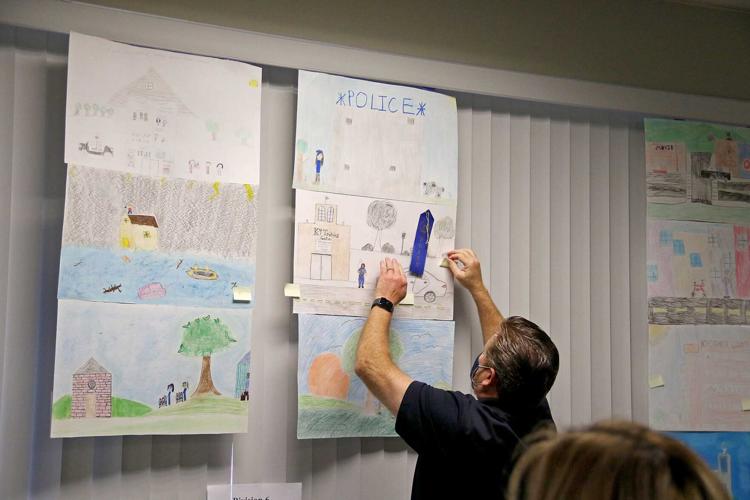 Area children draw themselves as police officers for poster contest ...