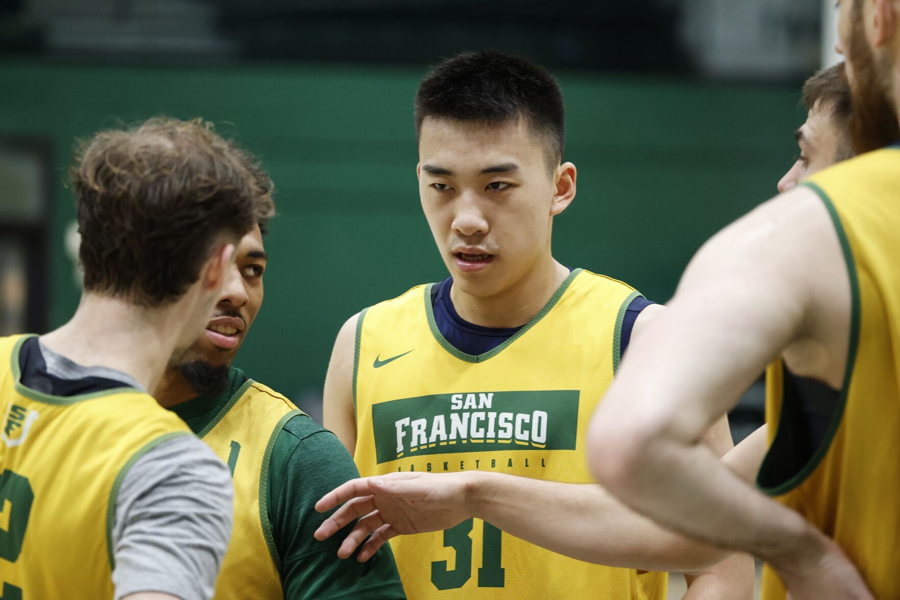 Mike Sharavjamts, Junjie Wang blaze trails to USF basketball | The City | sfexaminer.com