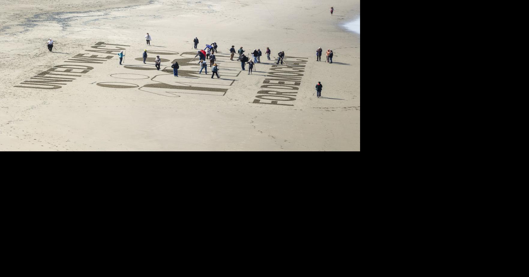 Volunteers create sand-etched protest message at Ocean Beach | The City ...