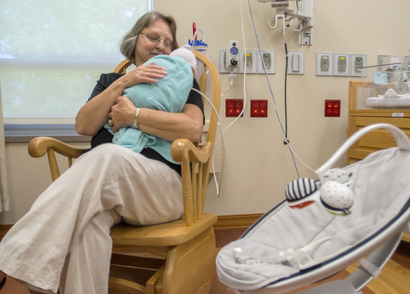Volunteers comfort, swaddle babies born with drugs in their systems ...