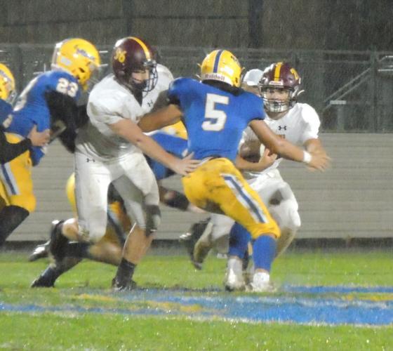 District playoff bound Bulldogs drop rain-soaked regular season finale ...
