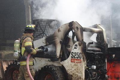 Area firefighters extinguish skid loader blaze | Police | shipnc.com