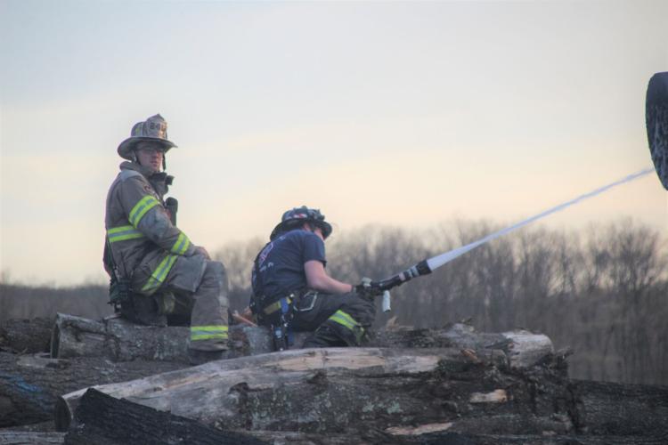 Newville log fire burns | Police | shipnc.com