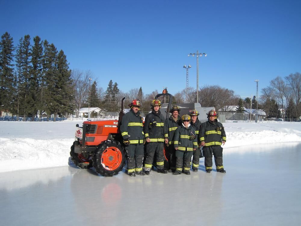 Firefighters build outdoor rink
