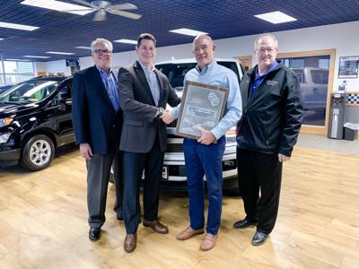 Ford presents Jensen with 25-year service award