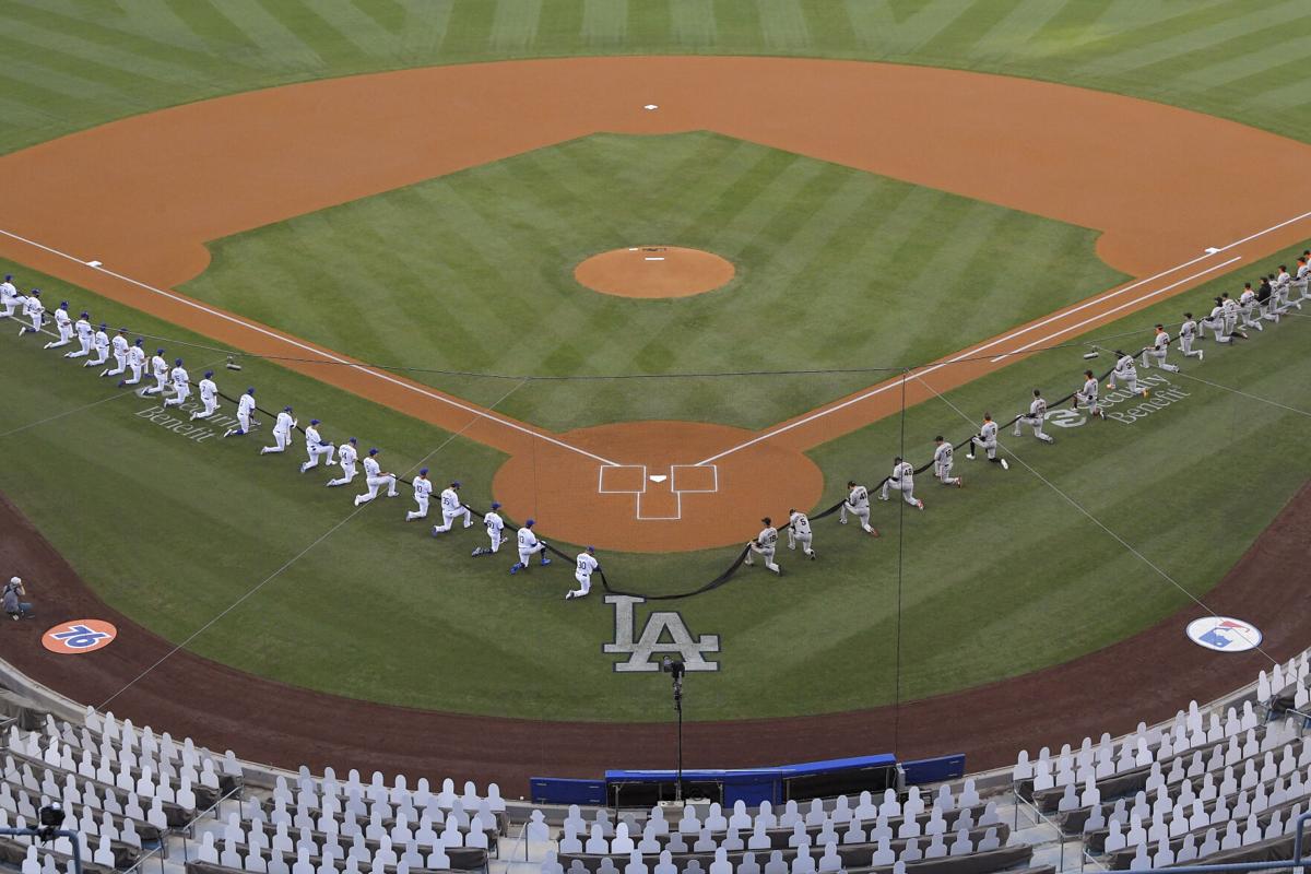 MLB: Empty stands, masked players as baseball returns
