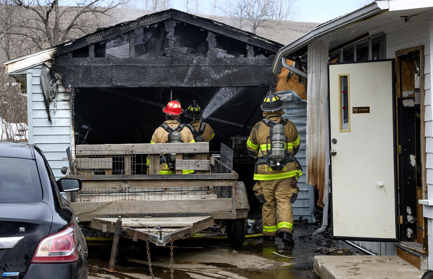 Man in custody after allegedly setting garage on fire
