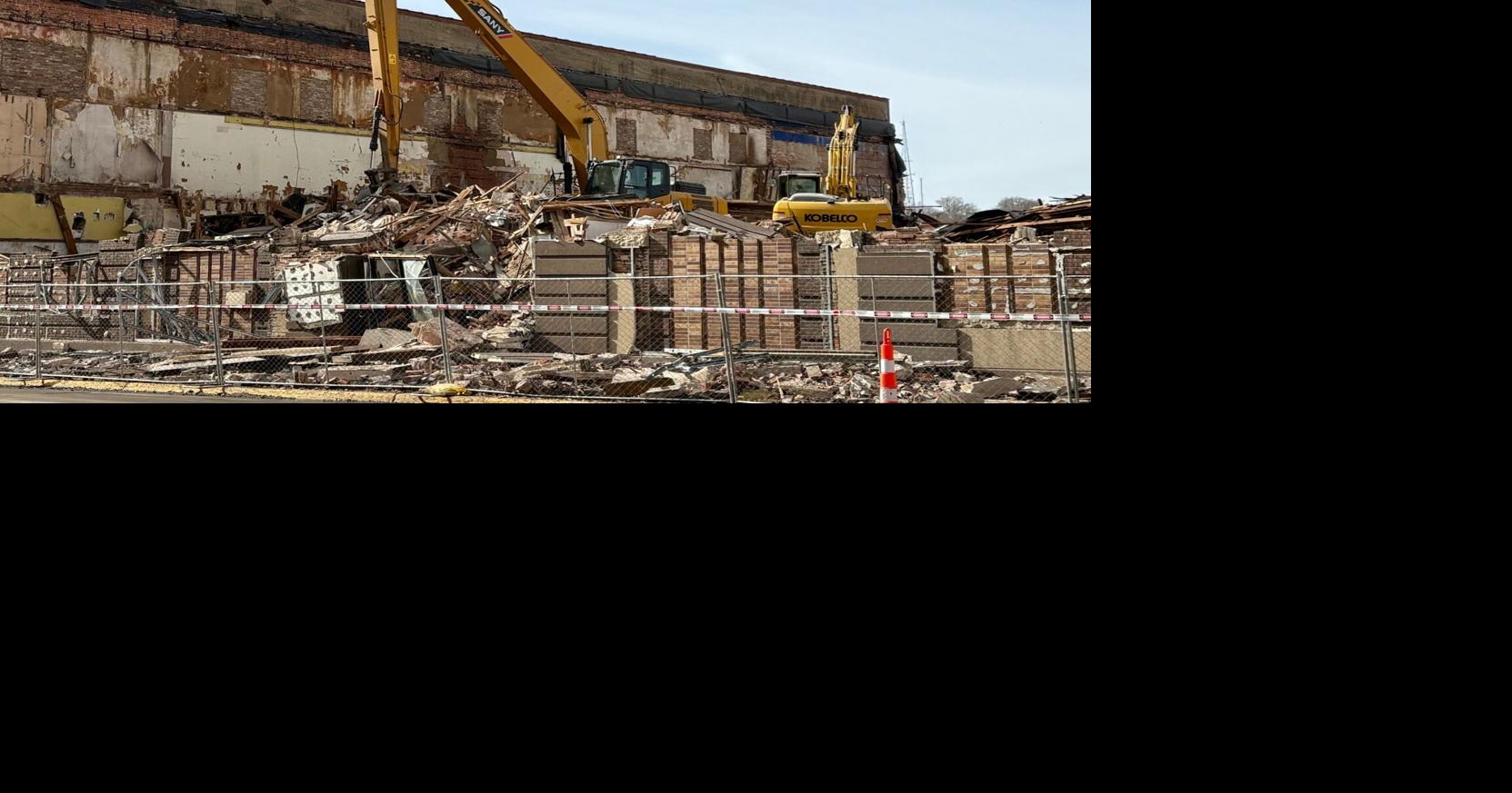 Crew mitigating asbestos during demolition of old auditorium