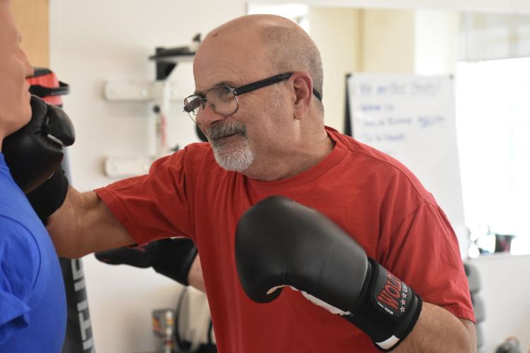 Seniors find boxing program helps with debilitating disease | Local ...
