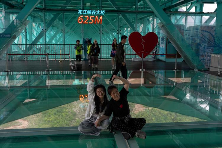 China’s highest bridge brings tourists and internet access to remote ...
