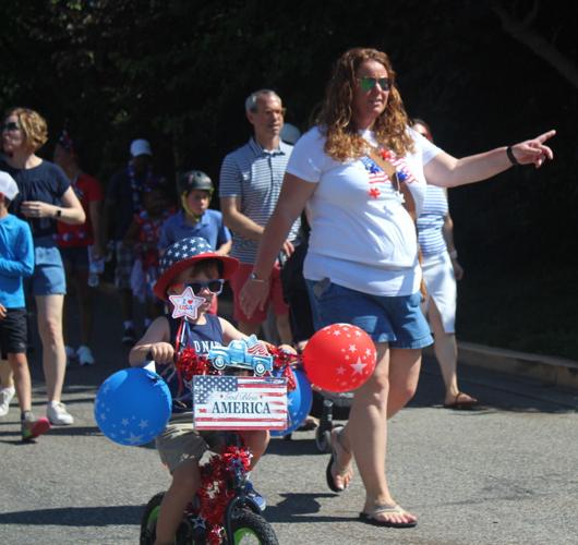 Children's Parade participants paint the town red, white and blue ...