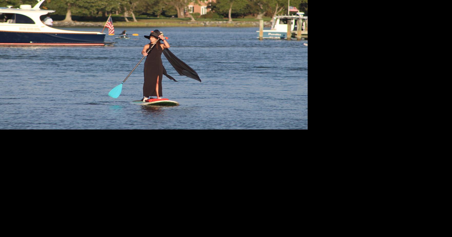 Broomsticks battle breast cancer in first witch paddle | Local ...