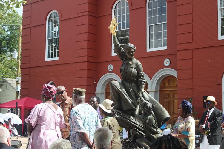 Day of Resilience ceremony unveils long-awaited statue | Local ...