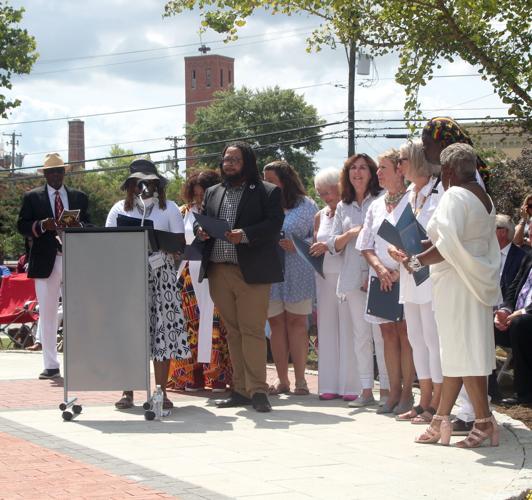 Day of Resilience ceremony unveils long-awaited statue | Local ...