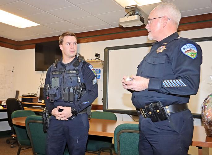 Badge pinning ceremony recognizes promotions, new officers