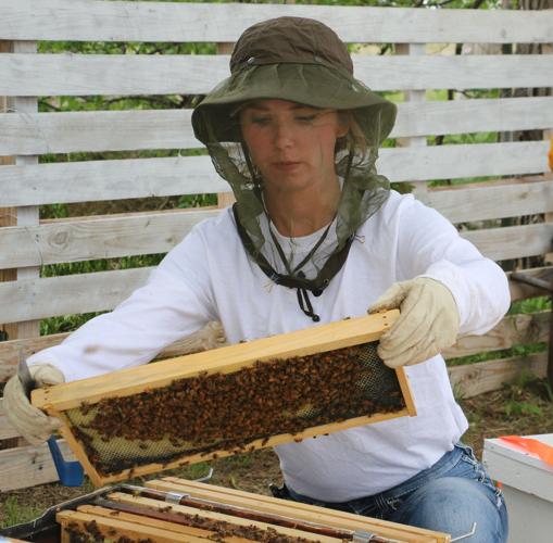 Local woman joining her grandfather, family, in exploring beekeeping
