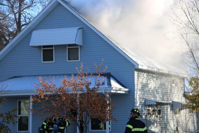 Firefighters battling attic fire