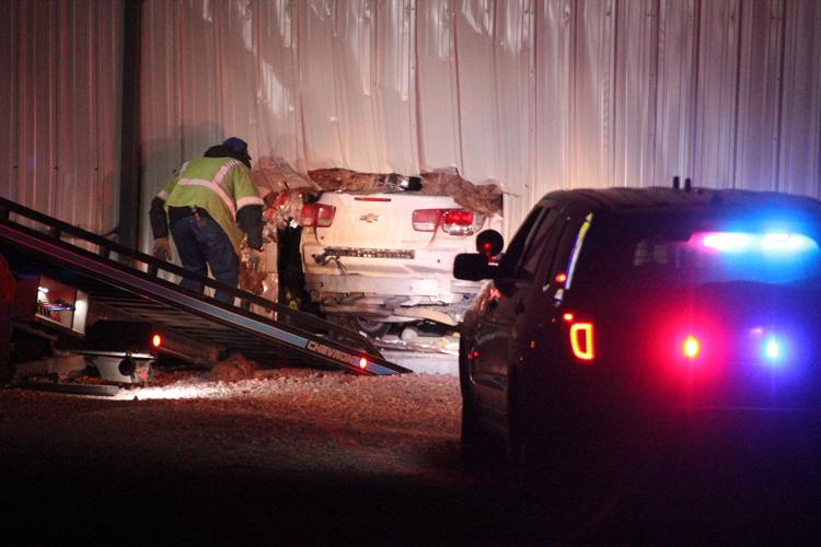 Woman cited on charges after driving car through building