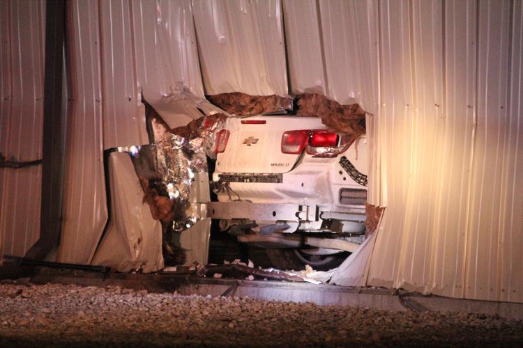 Woman cited on charges after driving car through building