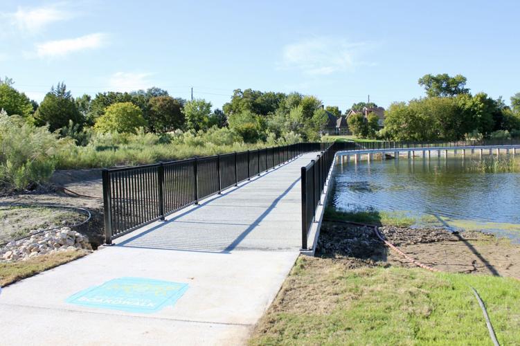 ‘Once again a landmark:' Beloved boardwalk returns to Moore Road Park ...