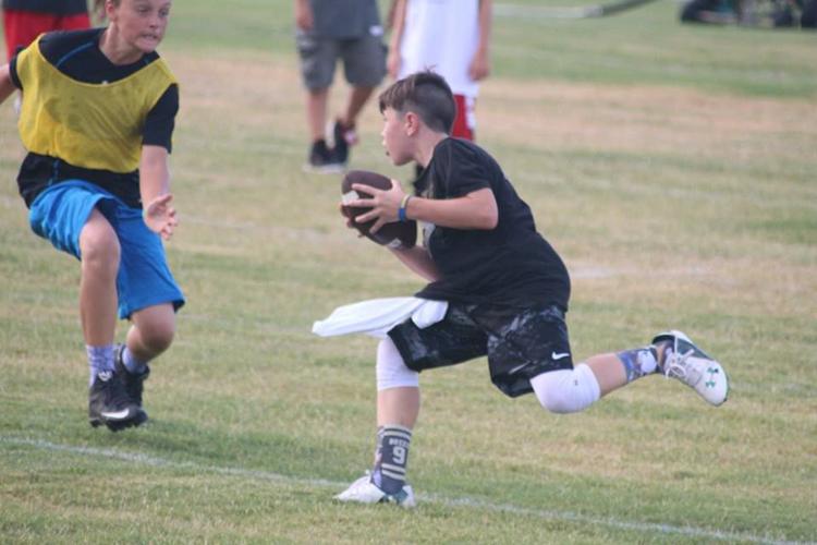 Lakeside Middle School football campers compete in touch football game ...