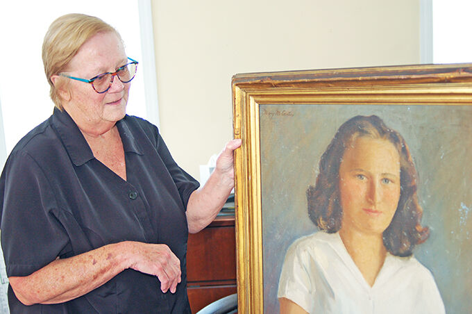 'Nurse Lady' portrait remains a mystery at city hall | Community Focus ...