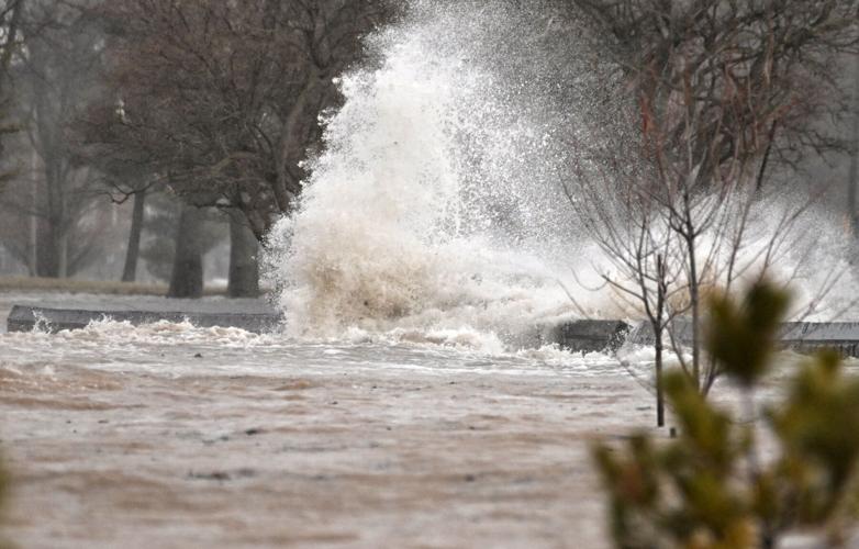 Lake Erie shoreline caked in ice as winds whip up waves