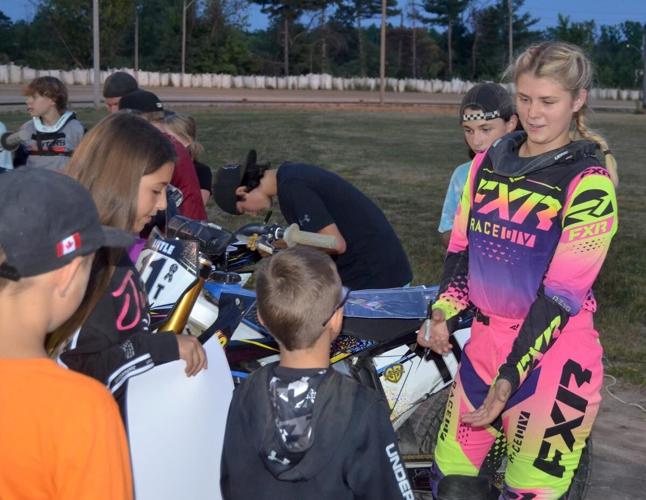 Autograph night lets young racing fans see their heroes and their ...