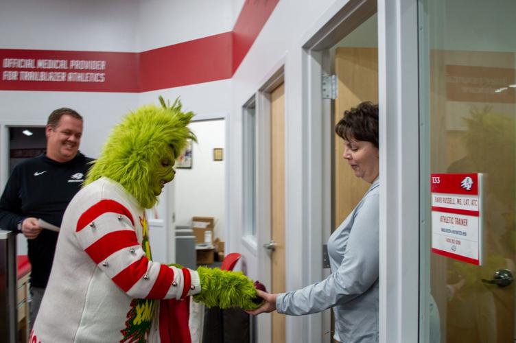 Not so mean after all, the Grinch visits Southern Utah schools, hands ...