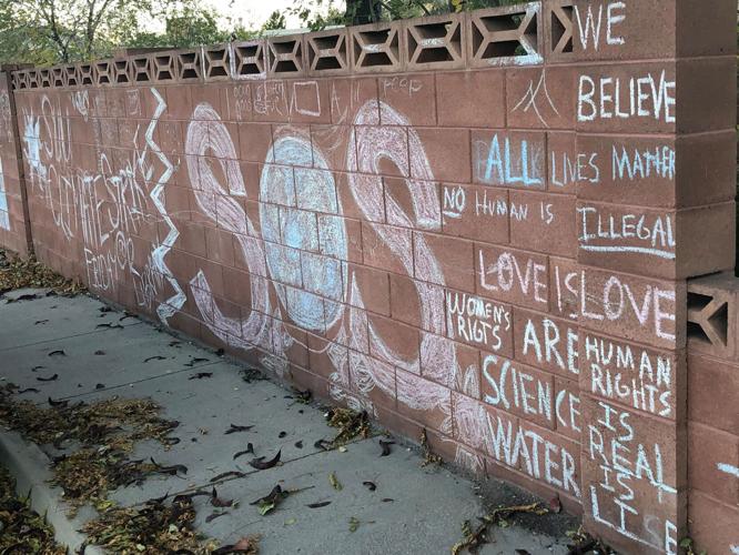 Graffiti or freedom of speech? SUU students wash off chalk from wall ...