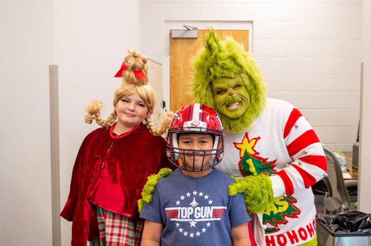 Not so mean after all, the Grinch visits Southern Utah schools, hands ...