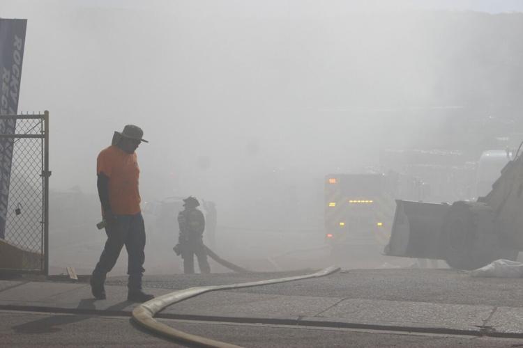 Rapidly spreading fire sends smoke billowing from recycle facility ...
