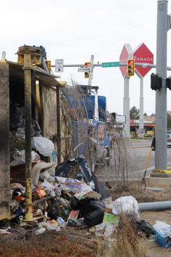 Garbage truck crash spills trash, takes out light pole and hydrant in ...