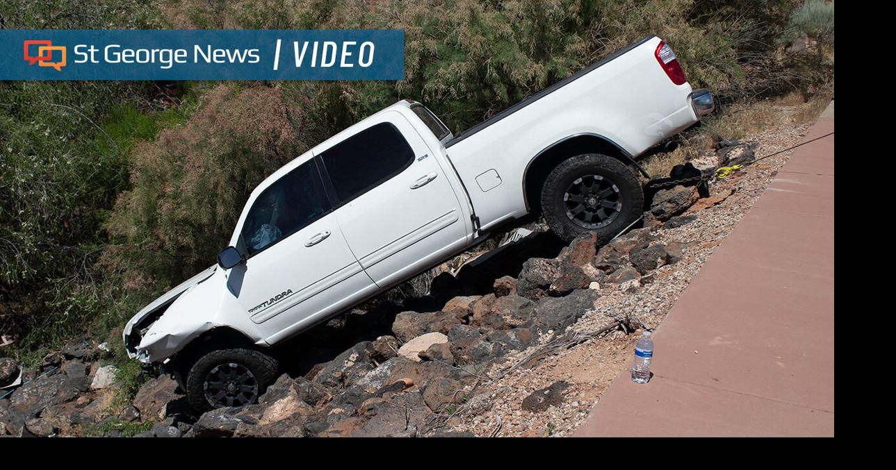 Truck veers across Snow Canyon Parkway, through fence, over rocks, down ...