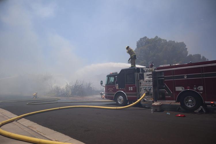 Multiple agencies respond to rapidly spreading brush fire that causes ...