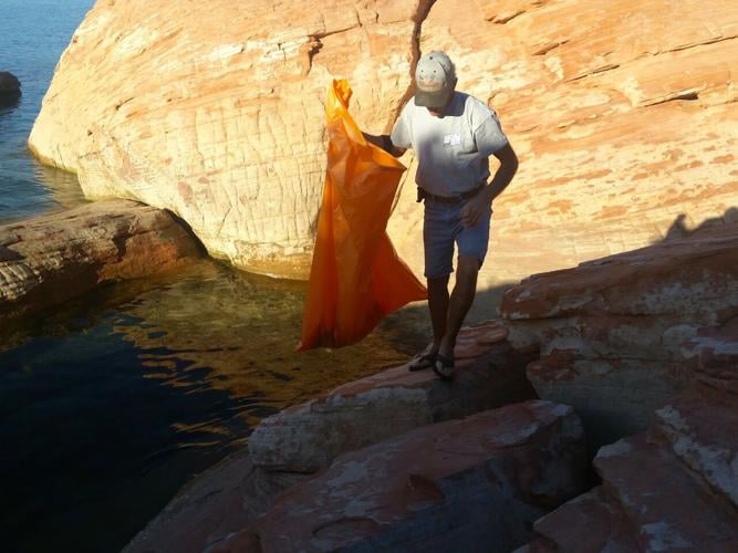 Volunteers dive, scour for trash, Sand Hollow jumping rocks | Life ...